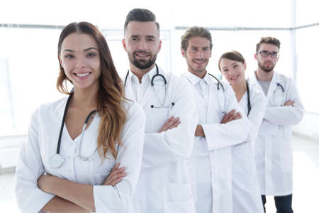 Portrait of medical team standing with arms crossed in hospital - Stock Image - Everypixel
