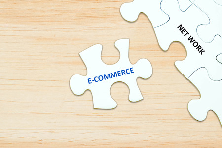 E-commerce and network words on jigsaw puzzle background, digital ...