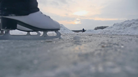 People skate on the skating rink in the winter on ice, active winter ...