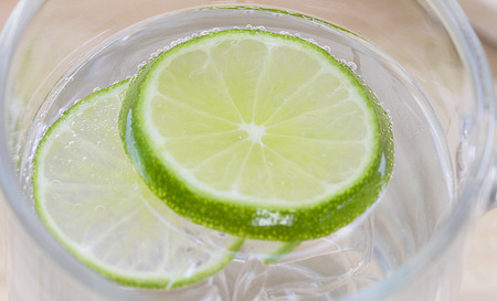 closeup lime in glass of soda, cold refreshing soft drink - Stock Image - Everypixel
