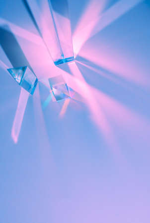 Glass prisms and cubes with color spectrum rays. Abstract background with reflection and ...