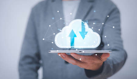 Businessman holding tablet connect to data information on the cloud icon computing network ...