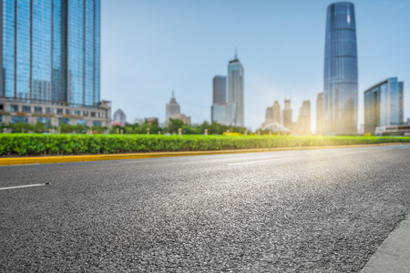 clean asphalt road with city skyline background,china. - Stock Image ...