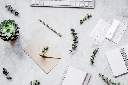 Work desk with spring flowers in home office concept on white ...