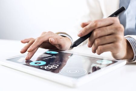 Businessman using tablet computer for project management. Close-up of ...