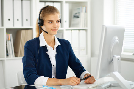 Modern business woman with headset in the office. Customer service ...