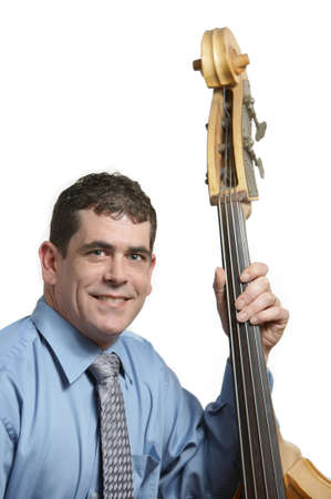 Acoustic bass player leaning against his instrumentの写真素材 [40004659252 ...