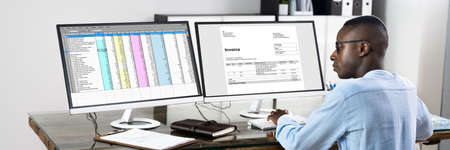 Tax Account Invoice Spreadsheet Report On Computer Monitor - Stock ...