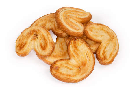 Small heap of the flat flaky crispy cookies made with puff pastry and ...
