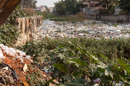 Big rubbish dump by the road in the river, ecological disaster - Stock ...