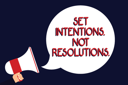 Writing note showing Set Intentions. Not Resolutions.. Business photo ...