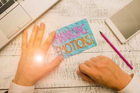 Writing note showing Managing Emotions. Business concept for ability be ...