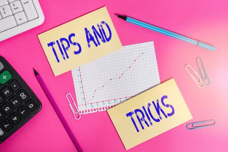 Writing note showing Tips And Tricks. Business concept for piece of ...