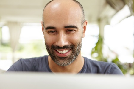 People and technology. Close up shot of happy face of attractive ...