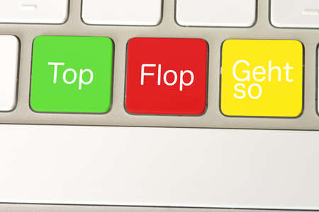 A computer and keys for top, flop and goes like thisの写真素材 [40124575708 ...