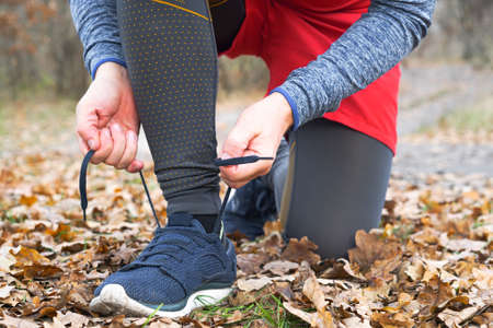 back view of young sport man with strong calves muscle running outdoors ...