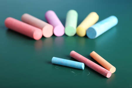 Color pieces of chalk on table, closeup - Stock Image - Everypixel