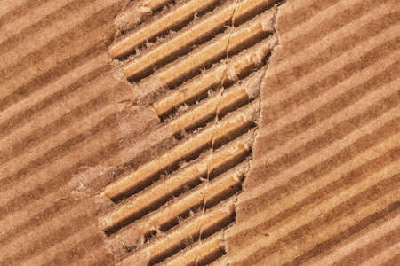 Photograph of recycle brown corrugated striped cardboard, coarse grain ...