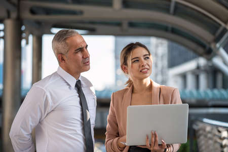 American businesswoman or her boss check business project progress on ...