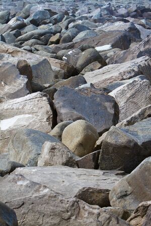 Jetty breaker boulders of large rocks to protect bayの写真素材 [40007565690 ...