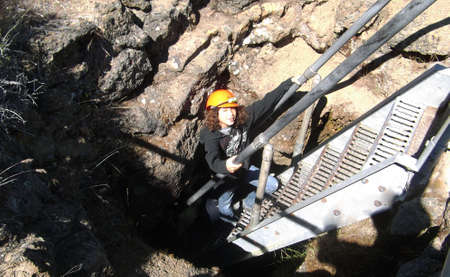 Young Spelunker emerging from a cave - Stock Image - Everypixel