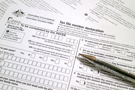Pen on the top of an Australian tax file number declaration form.の素材 ...