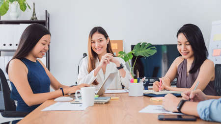 Group of beautiful Asian women meeting in office to discussion or ...