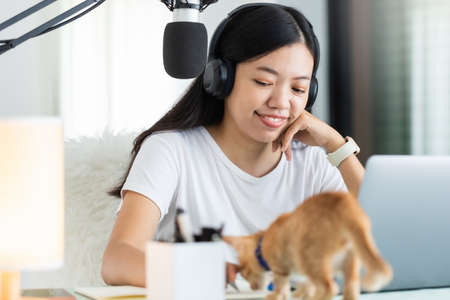 Asian woman student or businesswoman remote working from home with ...