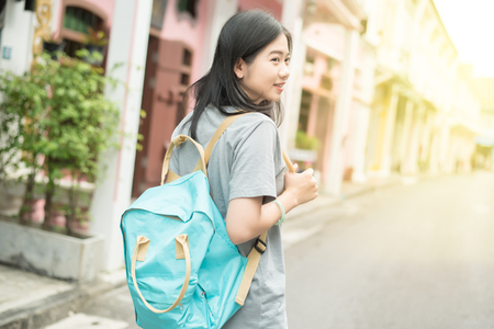 Young Asian traveling blogger or backpacker in a city phuket, Thailand ...