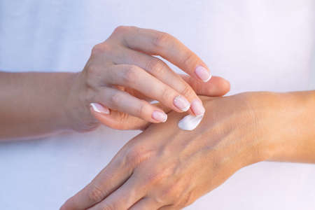 Closeup of woman hands with moisturizer, lotion or hand cream. Skin ...