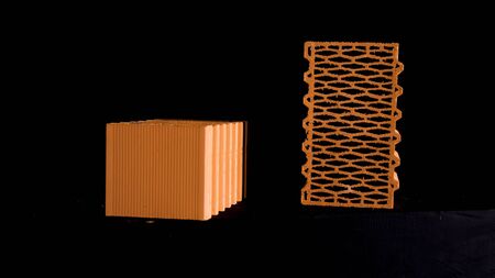 Wall construction materials, small pile of ceramic blocks isolated on ...