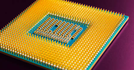 computer hardware. Processor lies on dark magenta matte surface. CPU ...