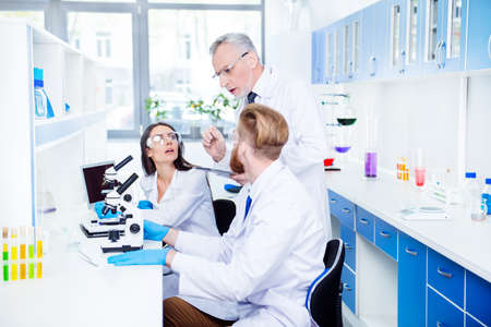 Team building concept. A group of scientists are discussing their ...