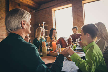 Portrait of nice attractive peaceful religious family meeting holding ...