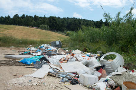Rubbish dumped by the side of a country road - Stock Image - Everypixel