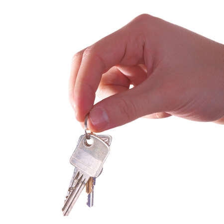 A hand is giving someone a bunch of keys. Isolated over white.の写真素材 ...