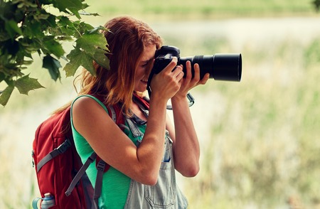 travel, tourism, hike, hobby and people concept - young woman with ...