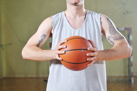 one healthy young man play basketball game in school gym indoor - Stock ...