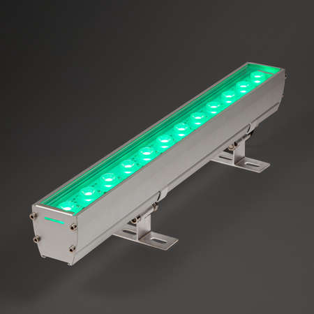 Green LED flood light in aluminum housing with wire on dark backgroundの ...