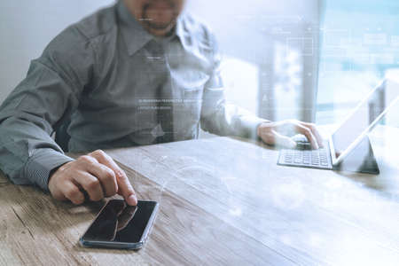 businessman using smart phone and keyboard dock digital tablet ...