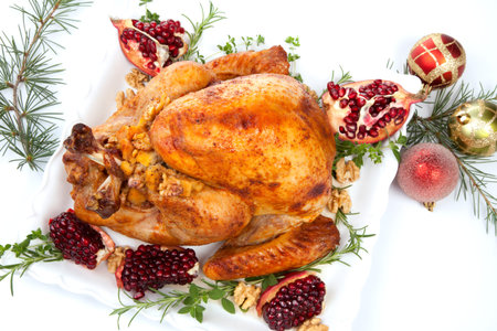 Pomegranate glazed roasted turkey on a tray garnished with fresh ...