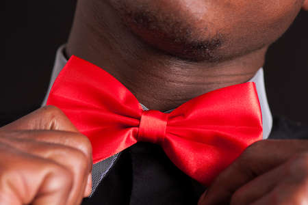 Red bow tie with black shirt closeup - Stock Image - Everypixel