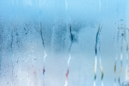 Window glass with condensation, strong, high humidity in the room ...