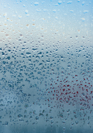 Water drops from home condensation on a window. Misted glass background ...