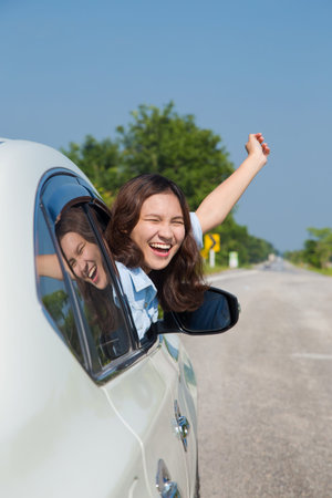 Asian woman, Young female driving happy about her new car or drivers ...