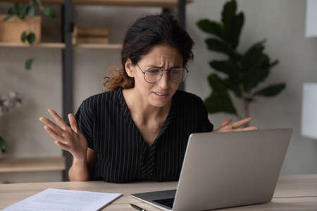 Close up upset businesswoman in glasses having problem with laptop ...
