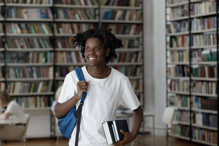 Happy motivated millennial African American student guy with dreads and ...