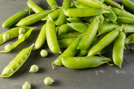 Pods of green peas on the background of concrete - Stock Image - Everypixel