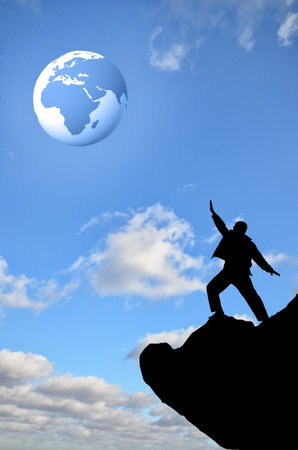 man on top of the mountain reaches for the moon - Stock Image - Everypixel