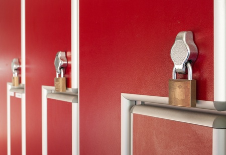 safety locks on red industrial metal lockers - Stock Image - Everypixel